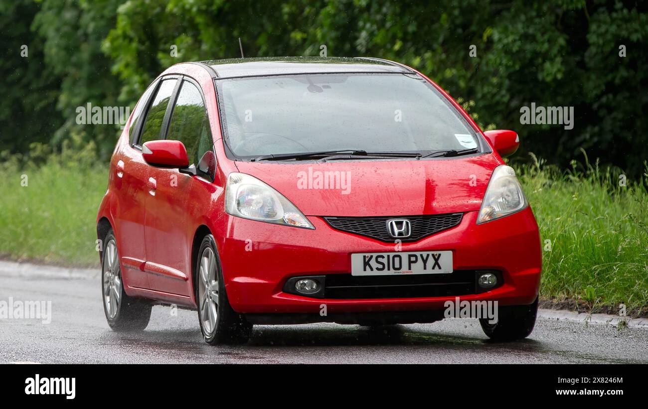 Stony Stratford,UK - May 22nd 2024: 2010 red Honda Jazz car driving on ...