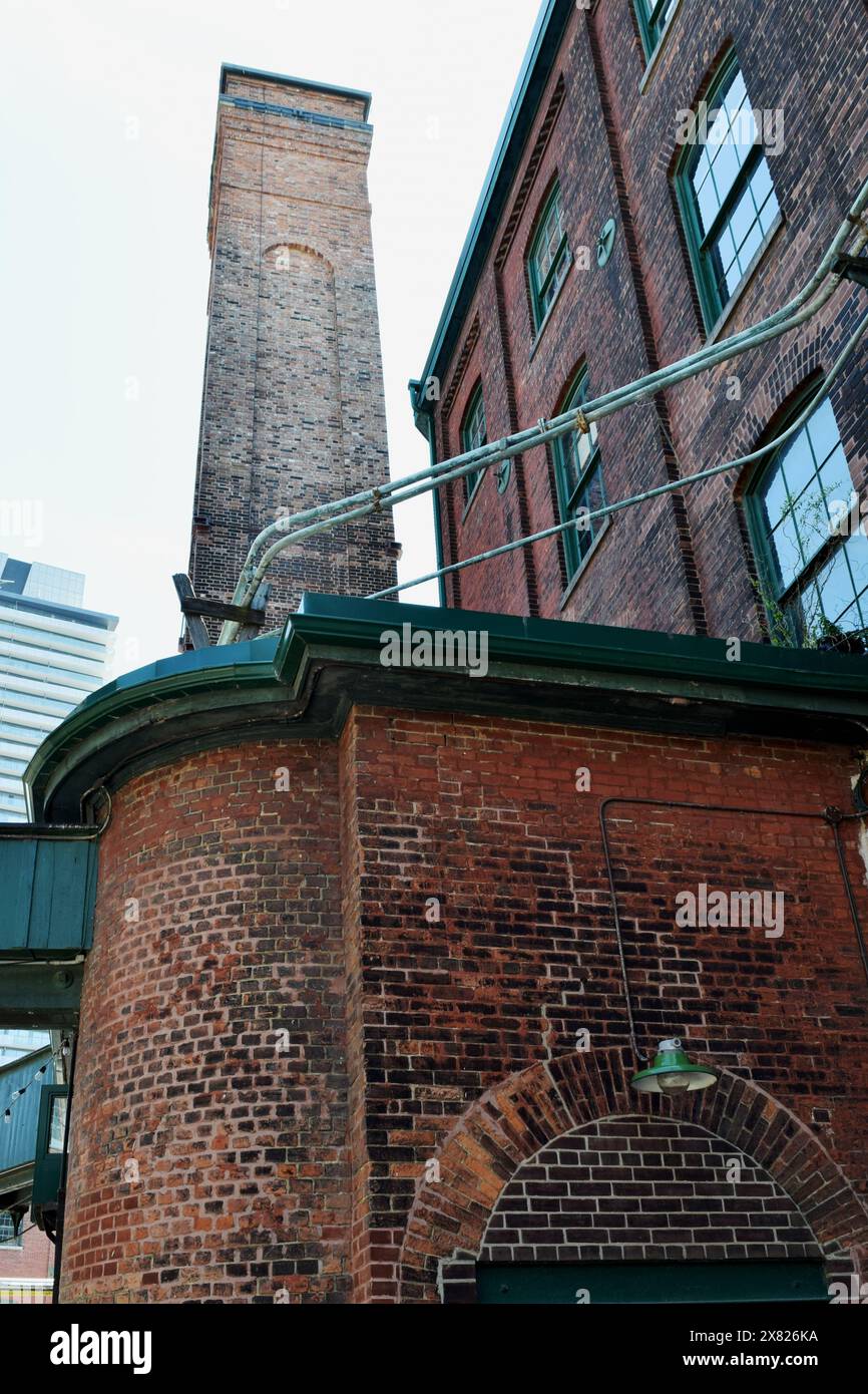 Tall Chimney and Old Brick Industrial Buildings, Historic Distillery ...