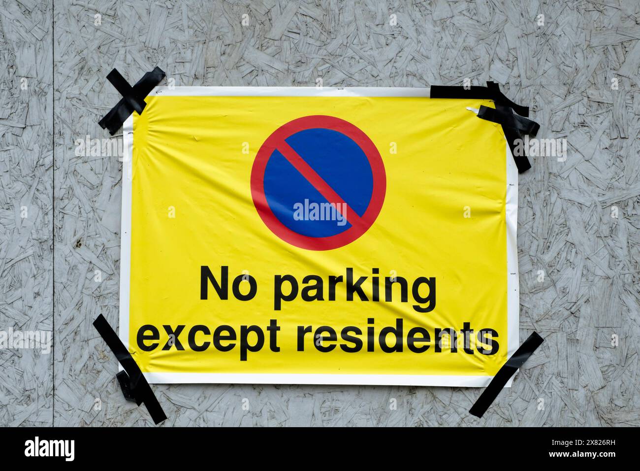 A yellow no parking except residents sign Stock Photo - Alamy