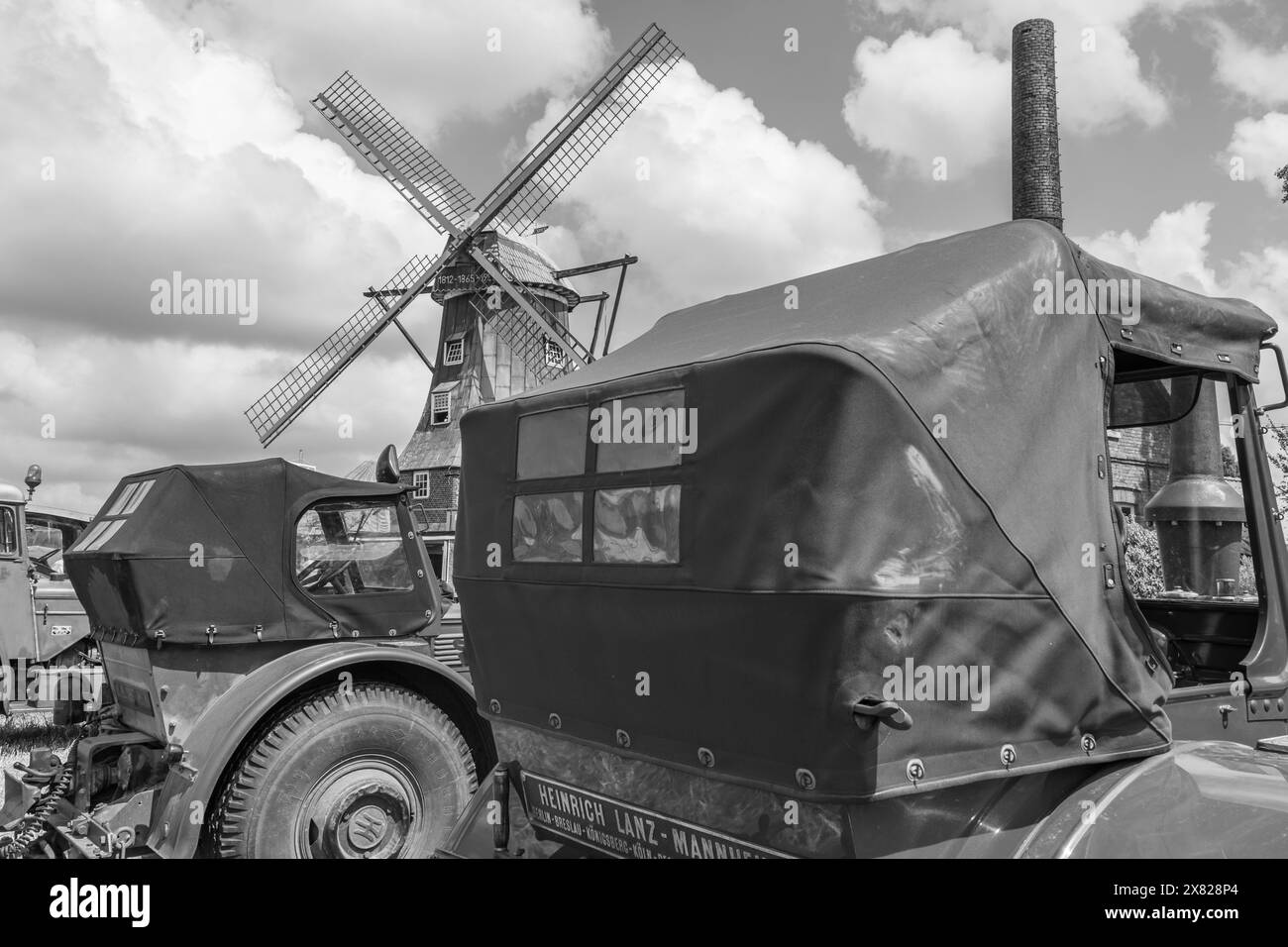 old tractors and a windmill Stock Photo - Alamy