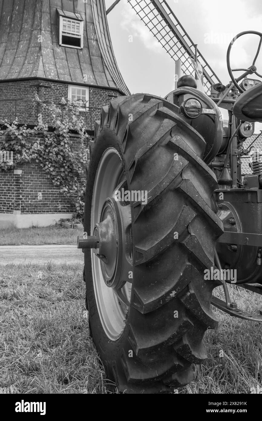 old tractors and a windmill Stock Photo - Alamy