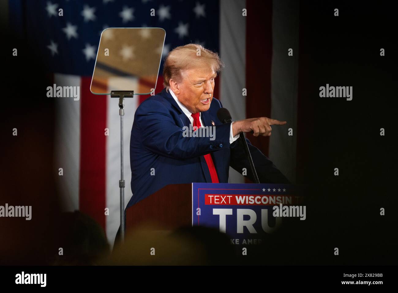 Donald Trump points intensely while speaking on stage at a campaign ...