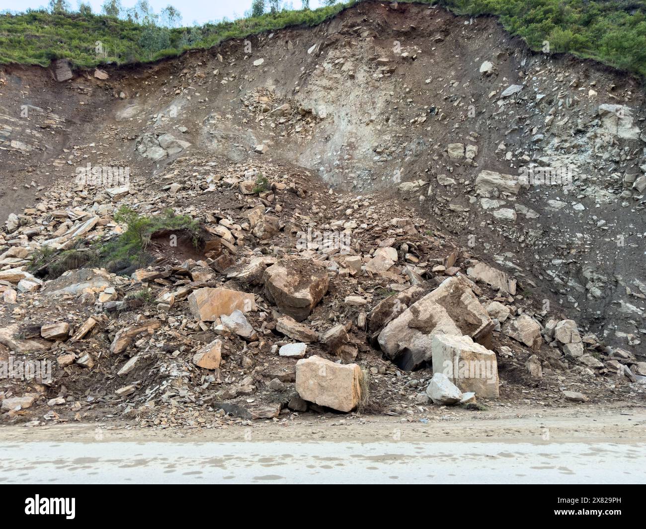 Large Rocks Block Road Due to Mountain Landslide Stock Photo - Alamy