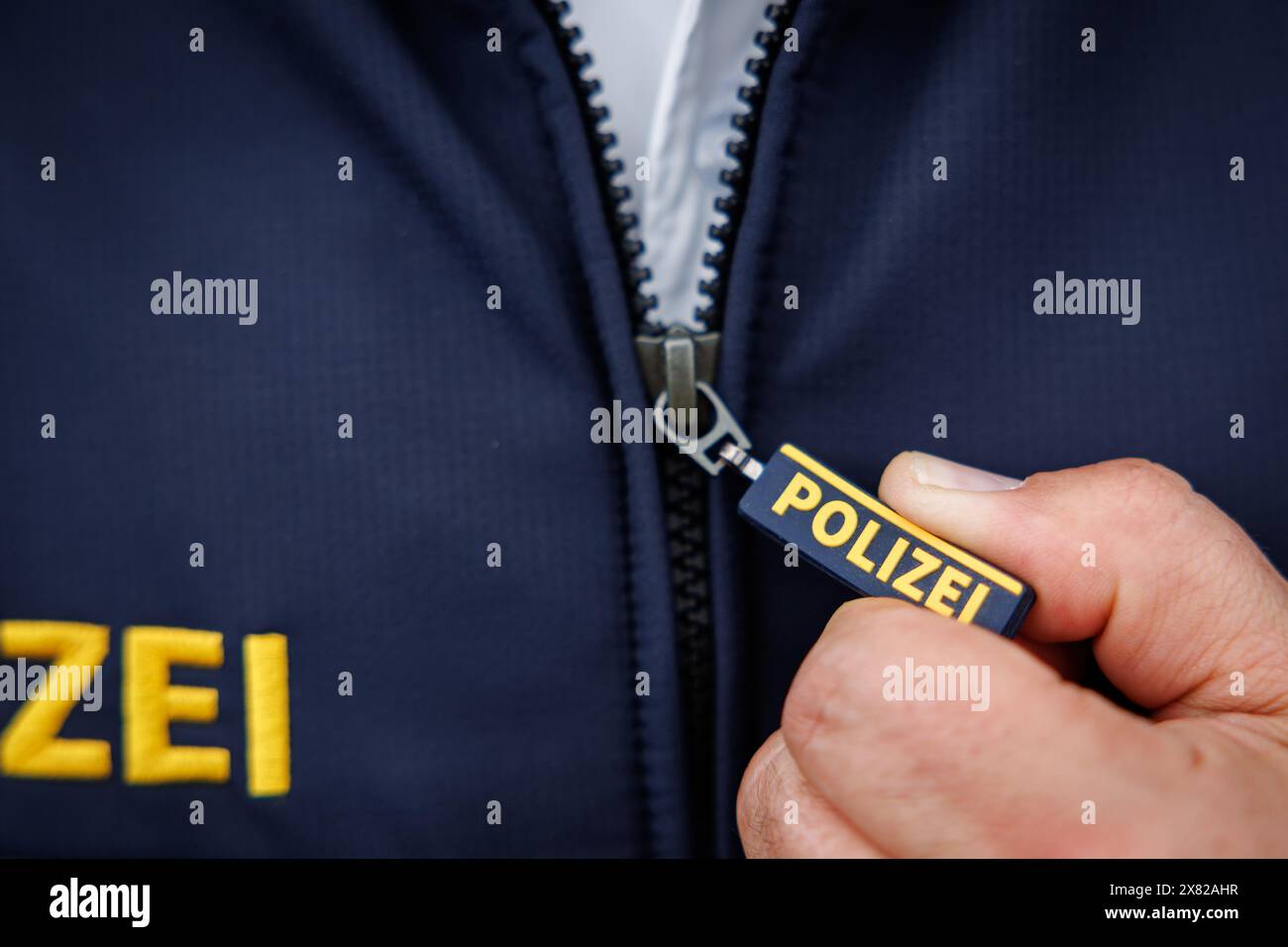 Nuremberg, Germany. 22nd May, 2024. The word "Police" is written on the zipper puller and the ...