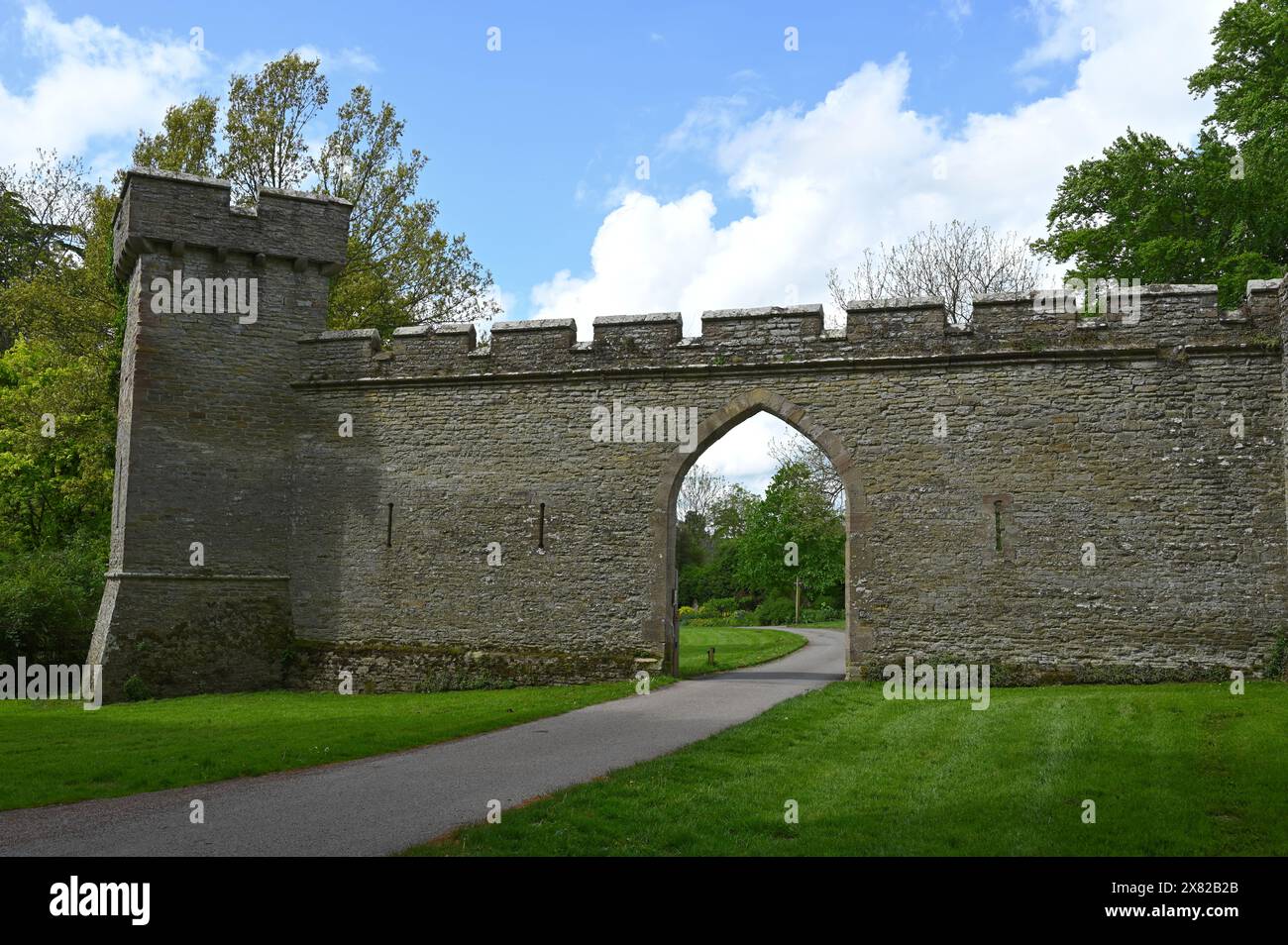 Crenallated wall and gothic arch at National Trust property Croft ...