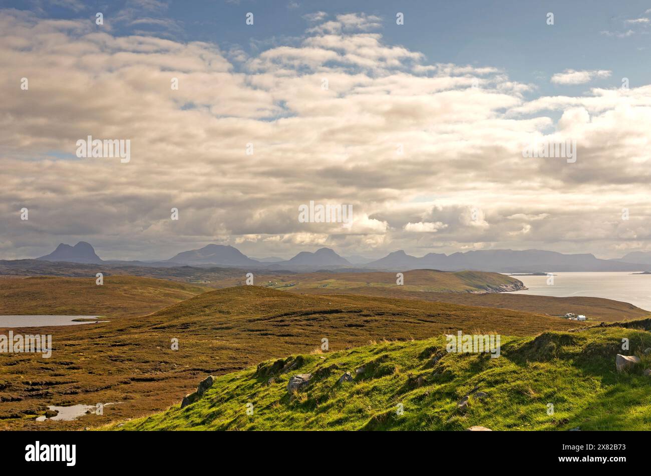 Mountains of Assynt and Coigach, seen in the distance in a line along ...