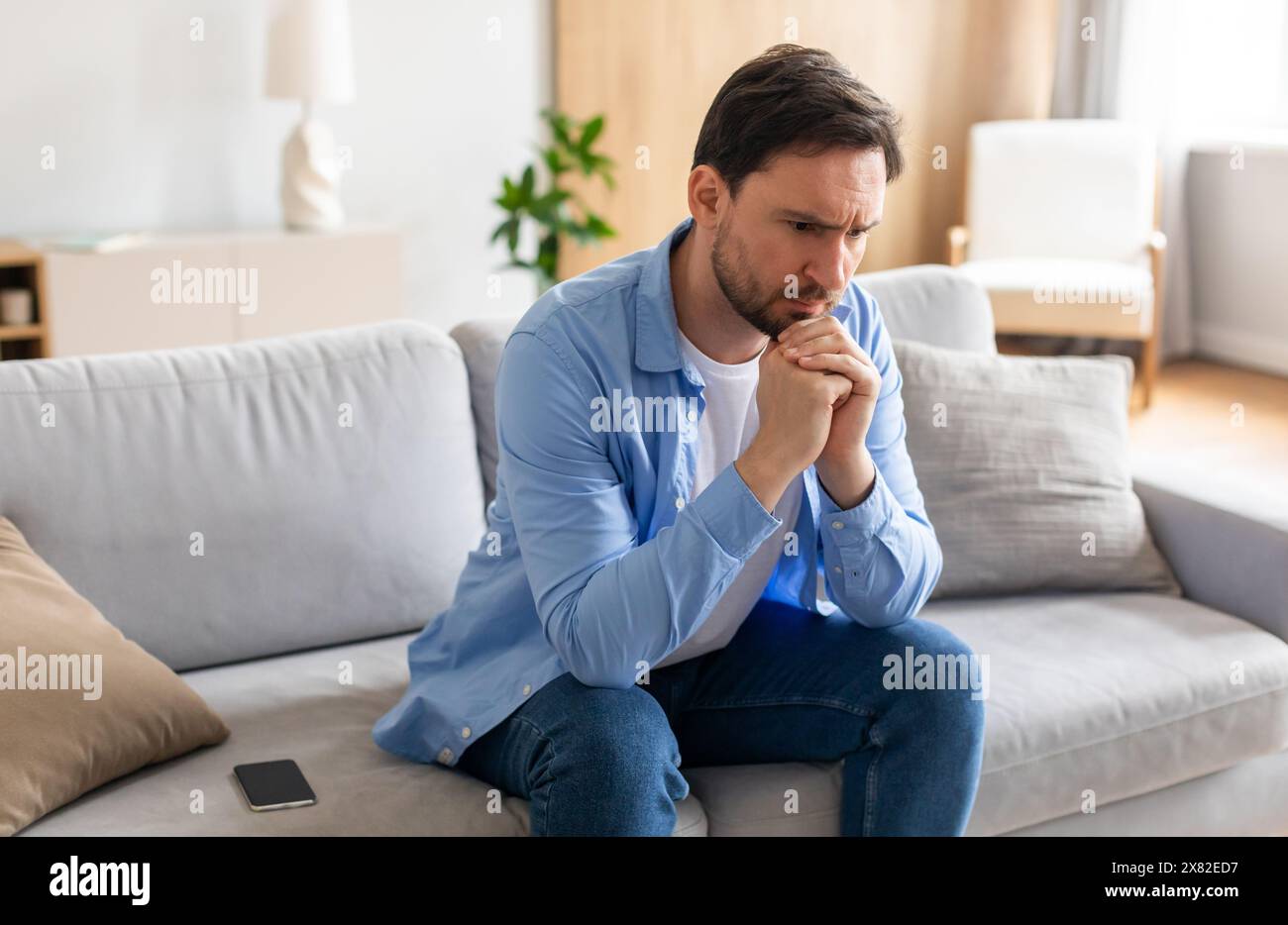 Body language man on couch hi-res stock photography and images - Alamy