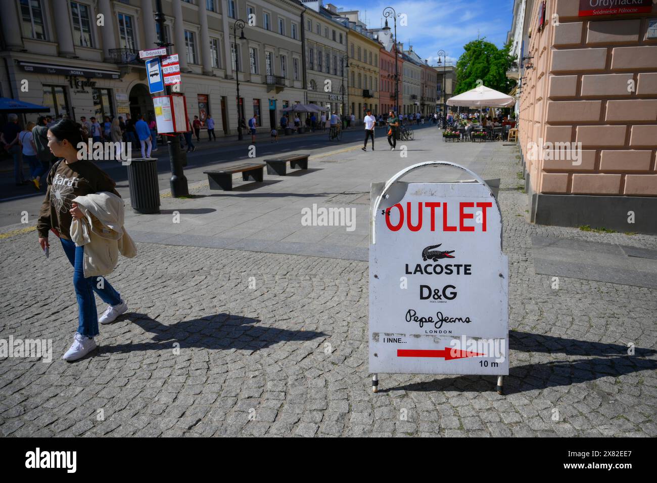 An advertisement for an fashion outlet is seen in the Old Town in ...