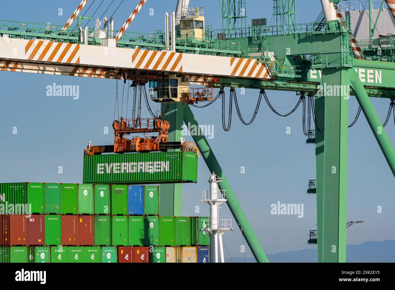 Los Angeles, California, USA - 12 January 2024: Container crane lifting ...