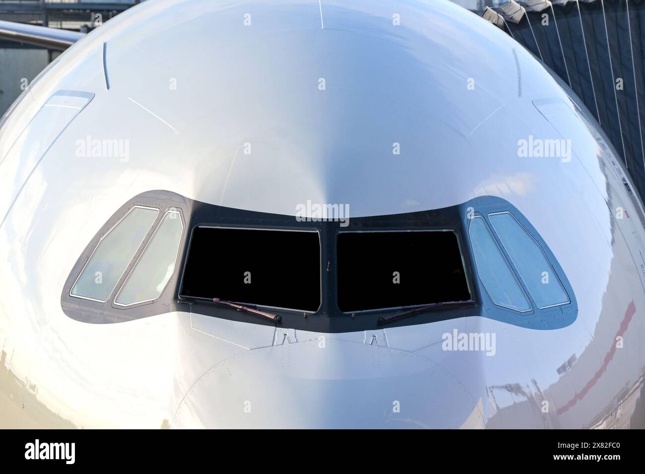 Close-up view of the front and cockpit windows of a wide bodied ...