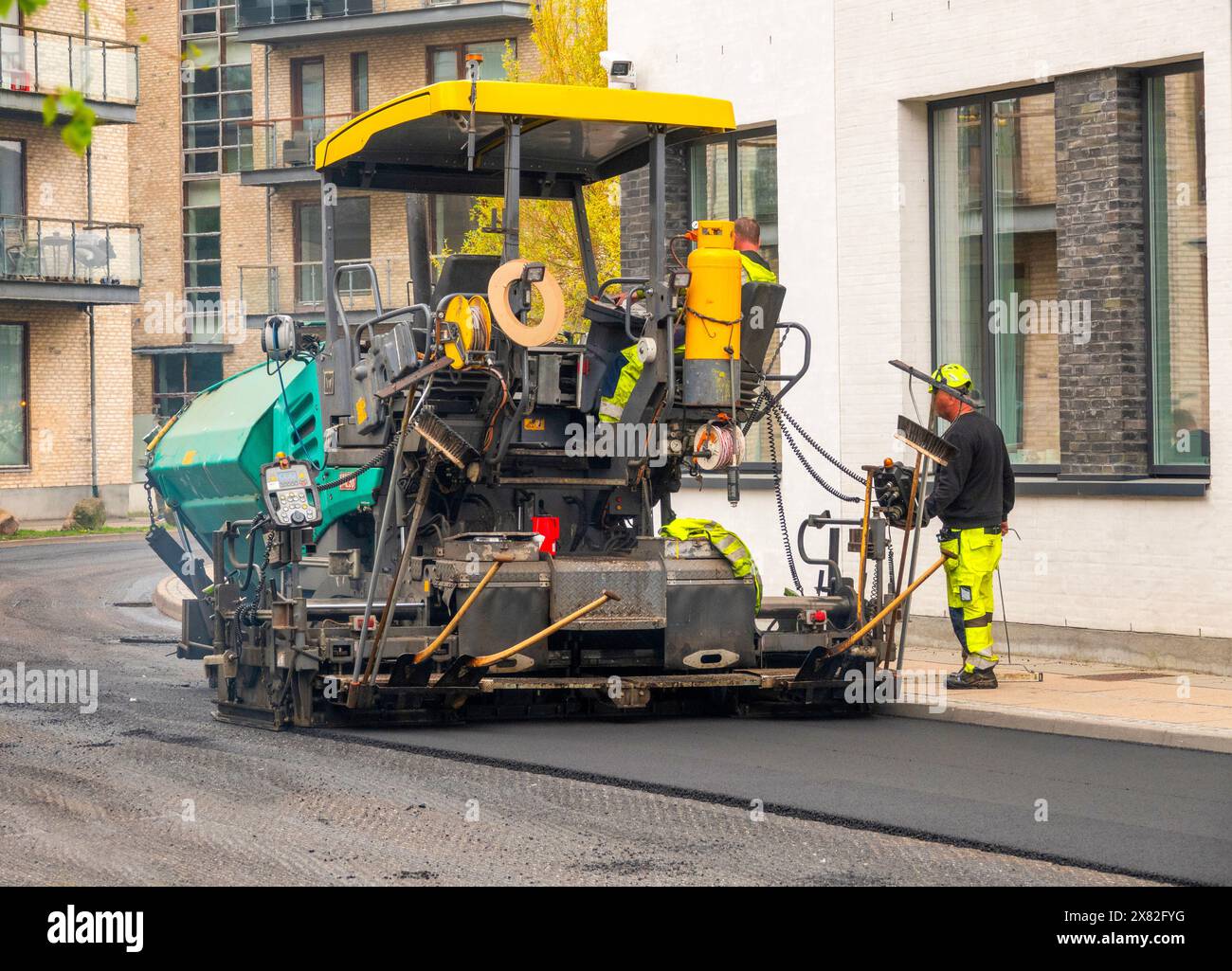Repair of asphalt road surface - old layer removed and a coating ...