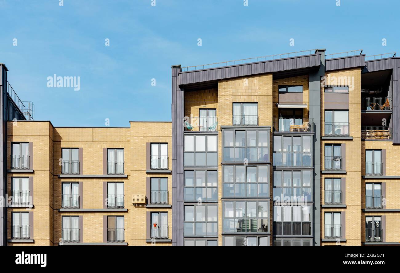 New modern residential building, luxury apartment block with balcony, urban house in European ...