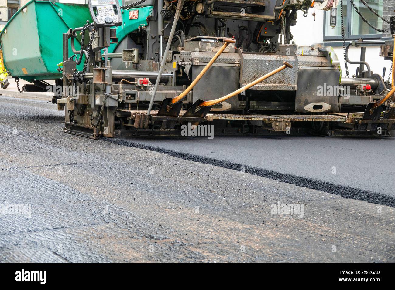 Repair of asphalt road surface - old layer removed and a coating ...