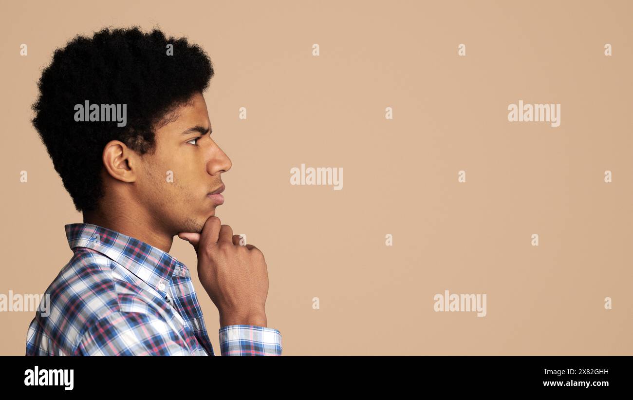 Thoughtful afro guy profile portrait on white background Stock Photo ...