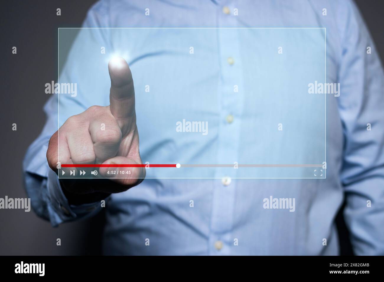 An unrecognizable man pointing a virtual floating screen of a streaming ...