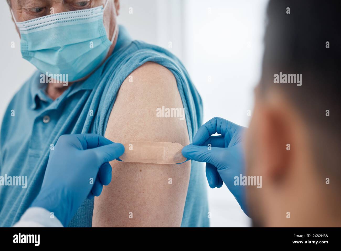 Elderly patient, doctor and plaster on arm or shoulder for virus ...