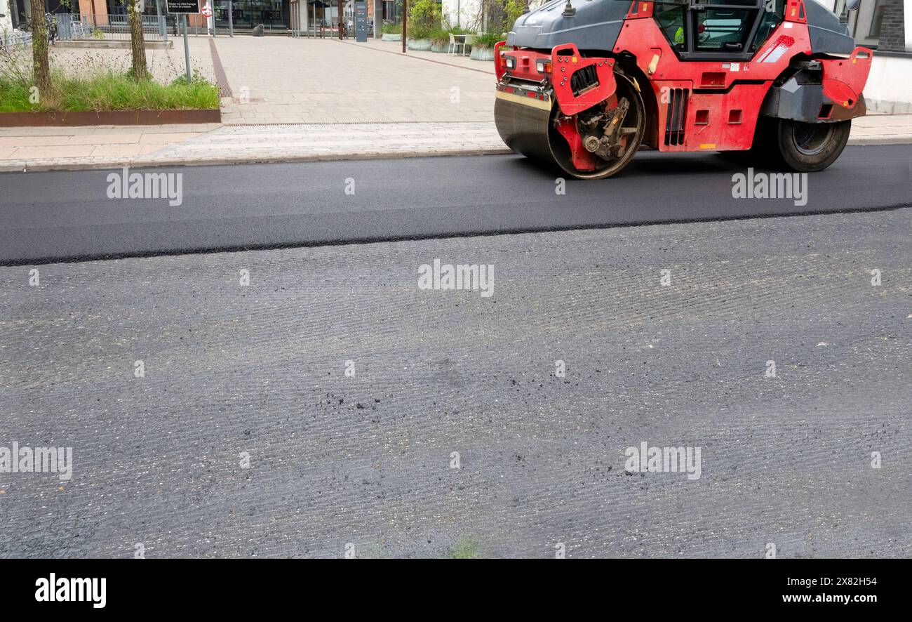 Road construction asphalt roller machine at work. Heavy Vibration ...