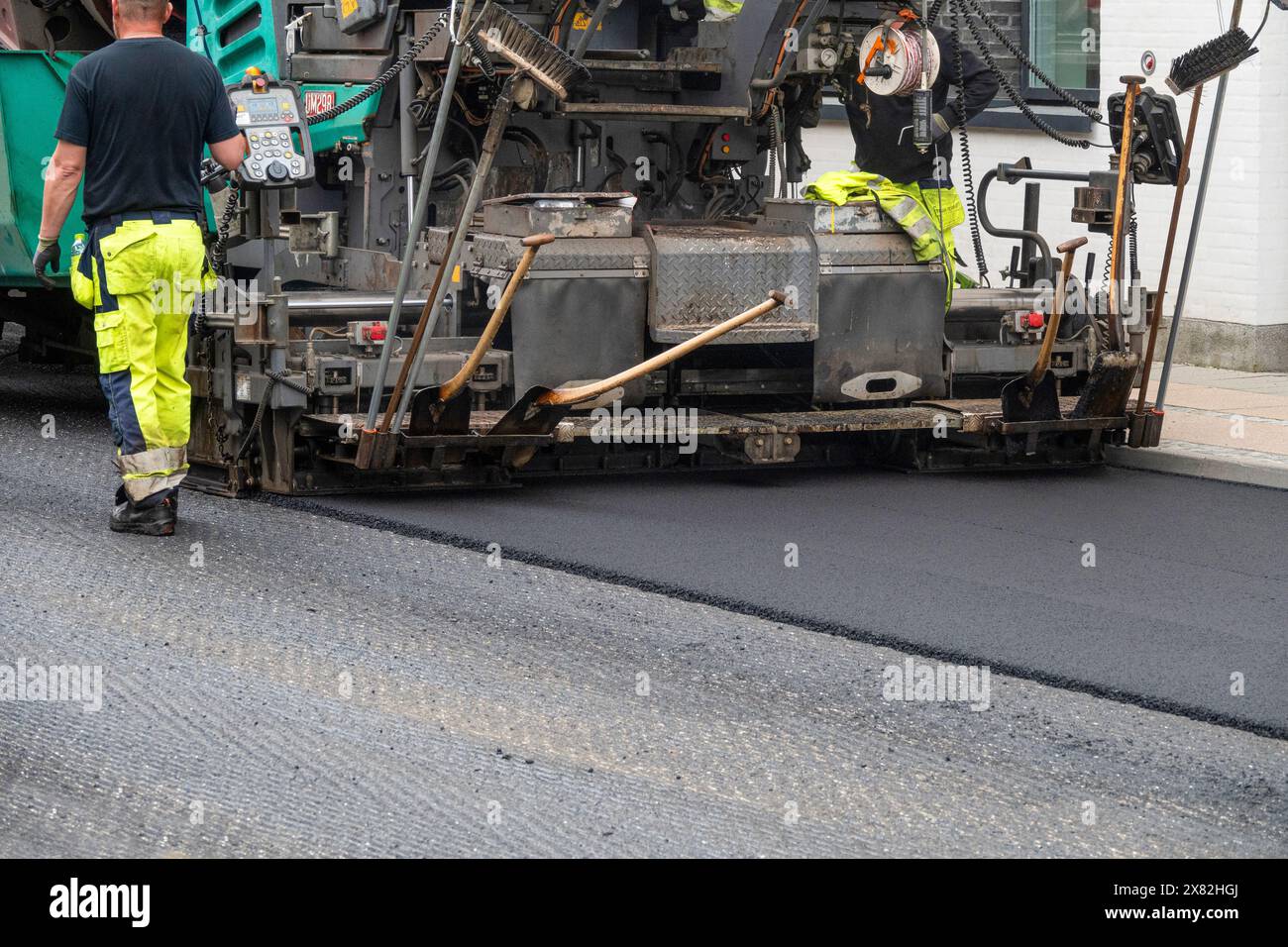 Repair of asphalt road surface - old layer removed and a coating ...