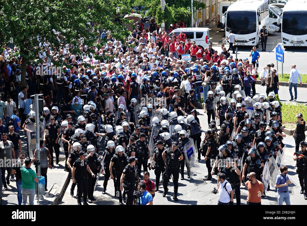 Protesters are seen trying to march despite the police blockade during ...