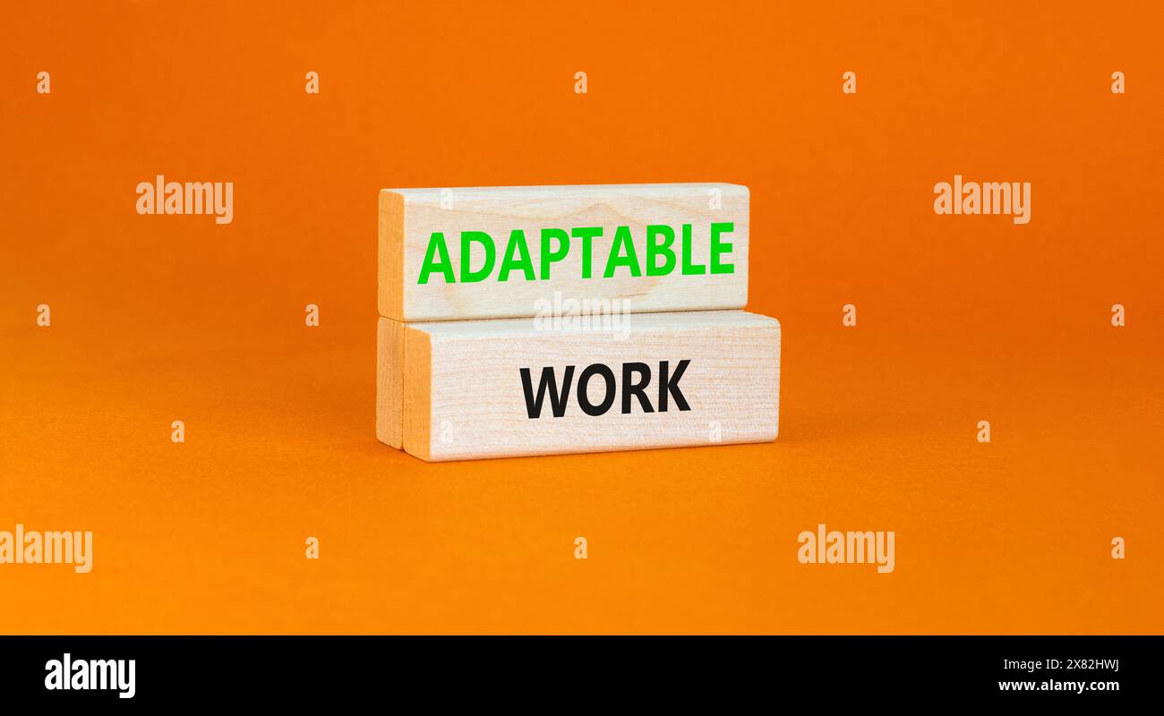Adaptable work symbol. Concept words Adaptable work on beautiful wooden block. Beautiful orange ...