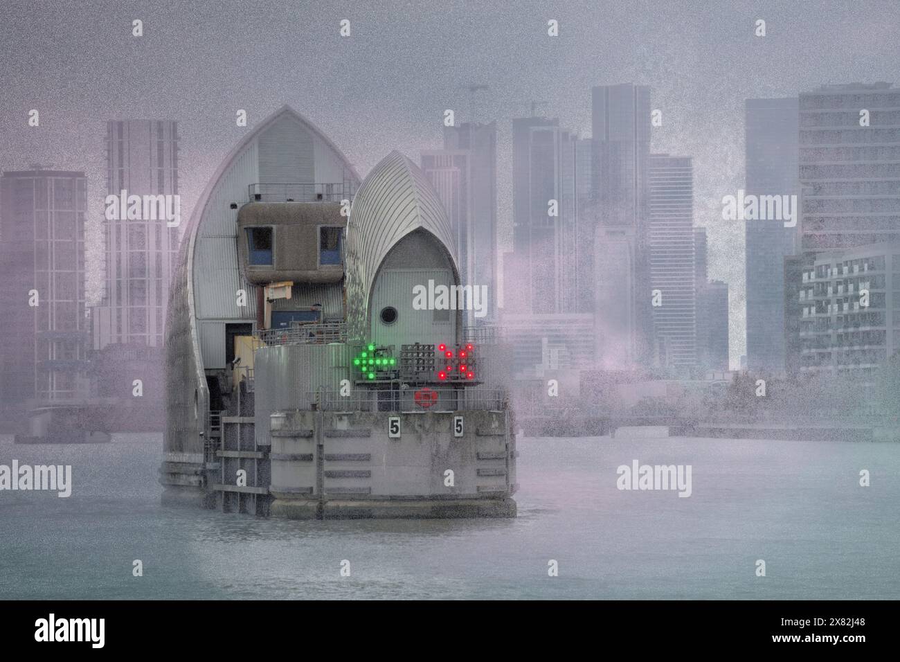 Thames Barrier gate number 5 on a foggy day with green and red ...