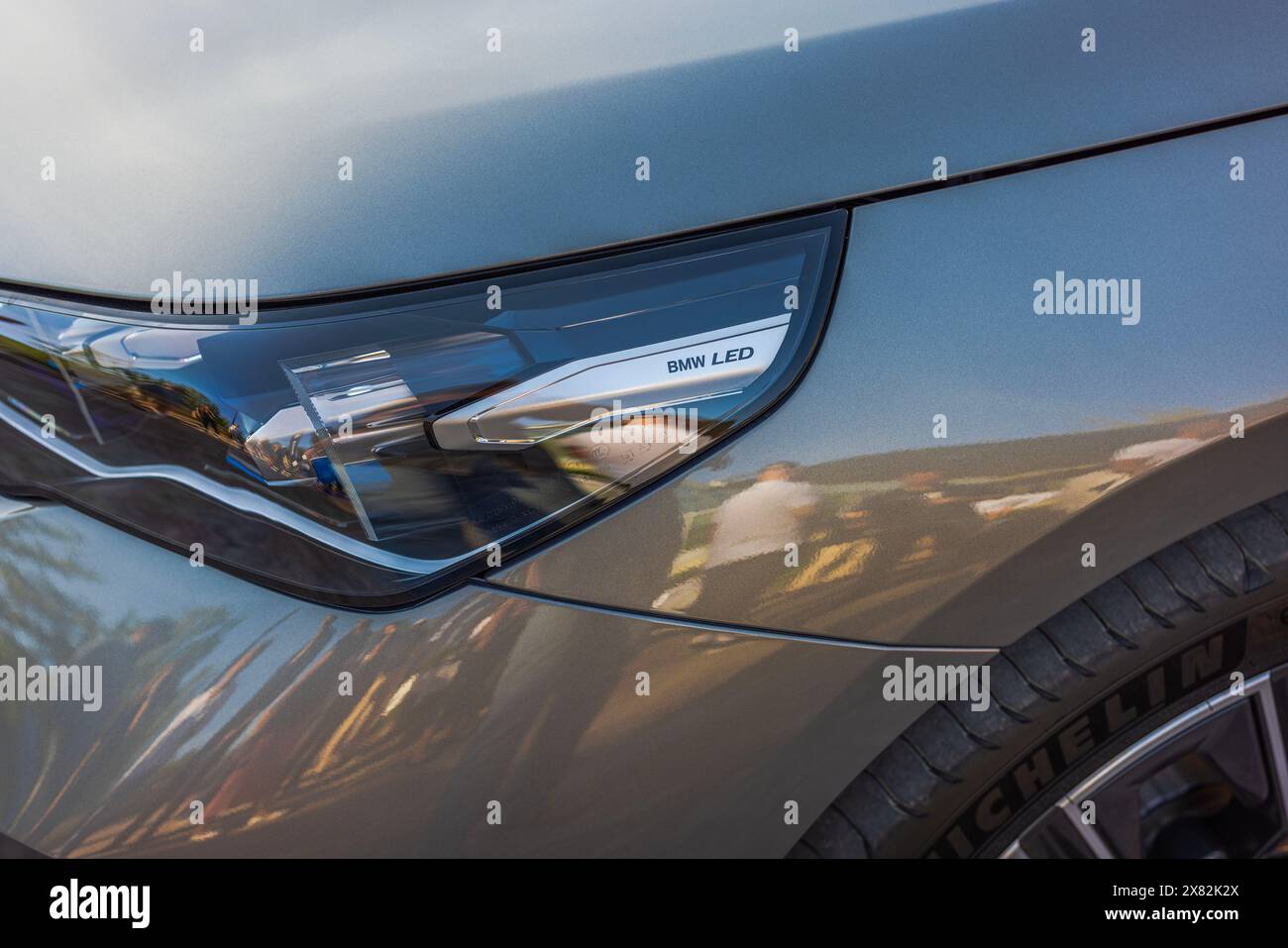 Close-up view of the new BMW i5 electric car with BMW LED headlights ...