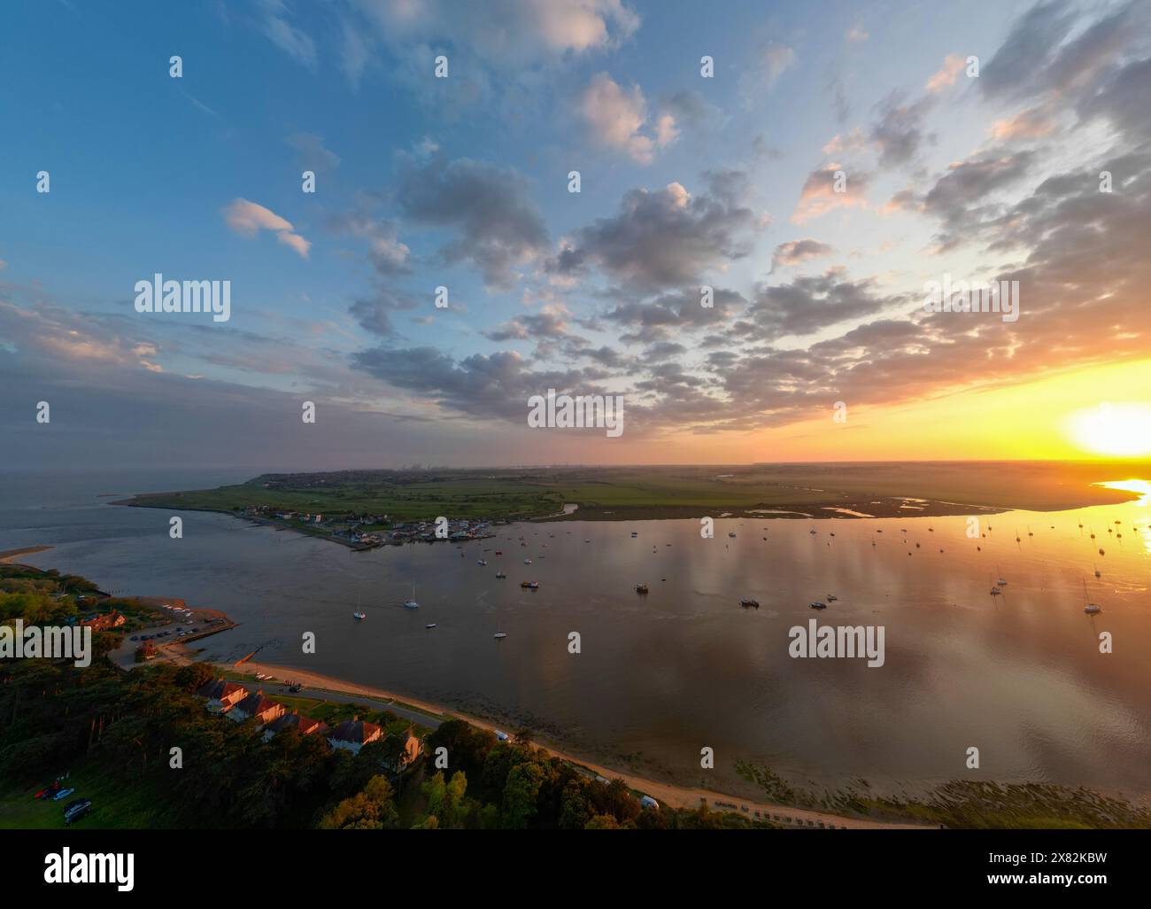 An aerial view of a spectacular sunset over the River Deben at Bawdsey ...