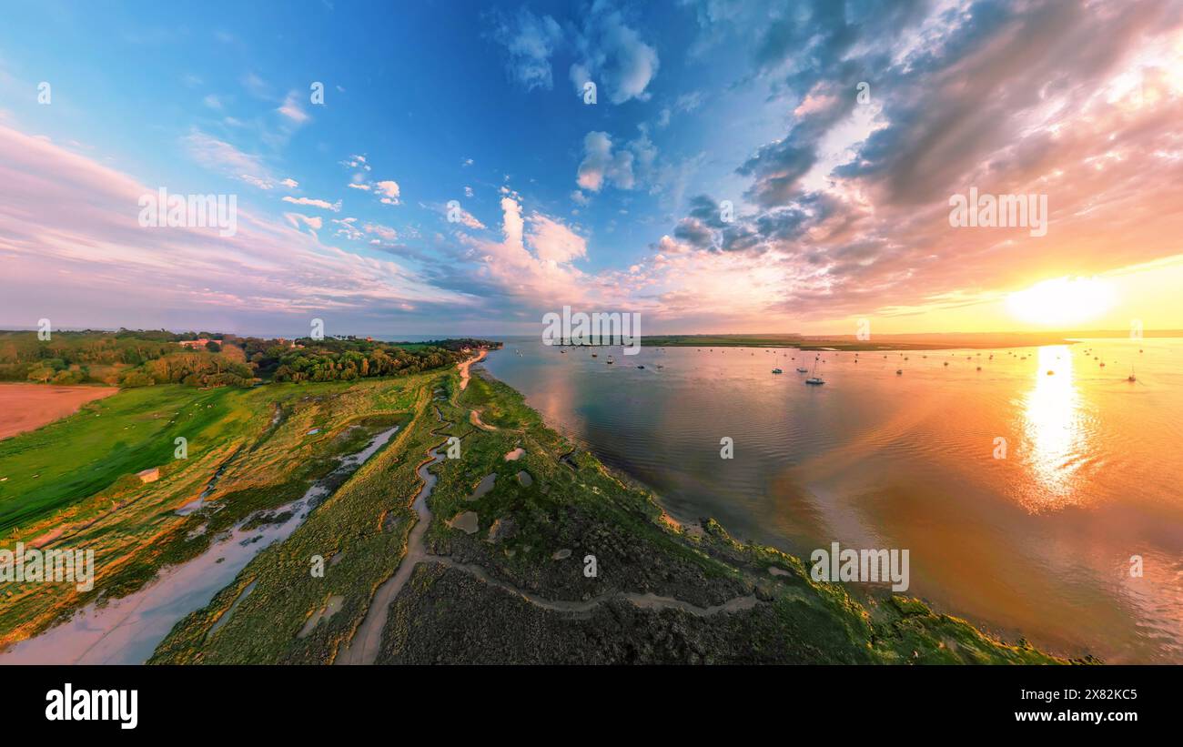 An aerial view of a spectacular sunset over the River Deben at Bawdsey ...