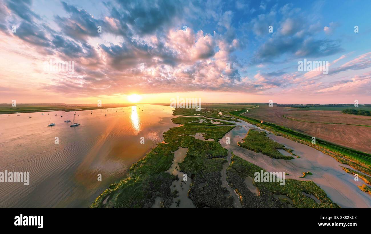 An aerial view of a spectacular sunset over the River Deben at Bawdsey ...