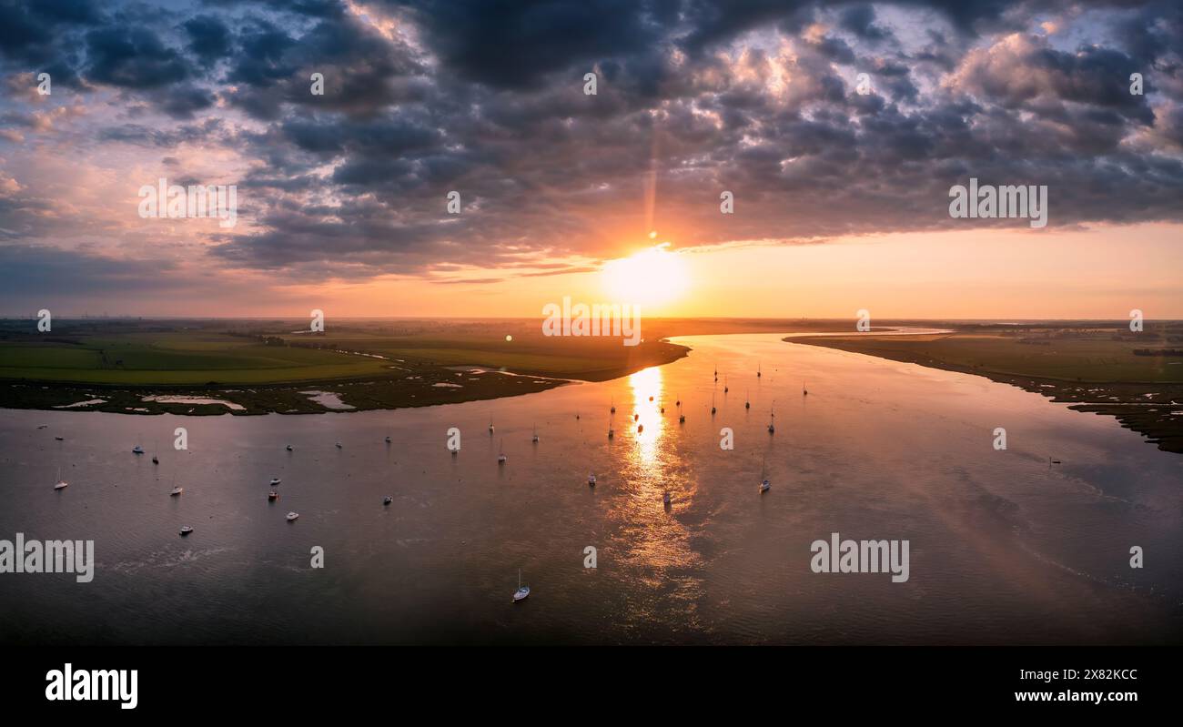 An aerial view of a spectacular sunset over the River Deben at Bawdsey ...