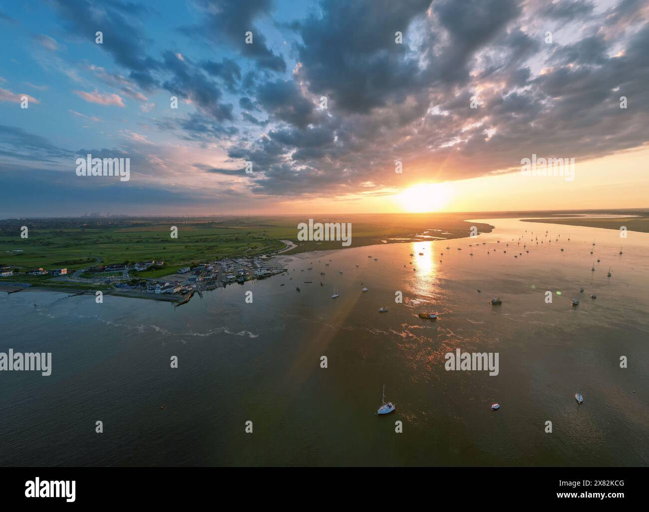 An aerial view of a spectacular sunset over the River Deben at Bawdsey ...