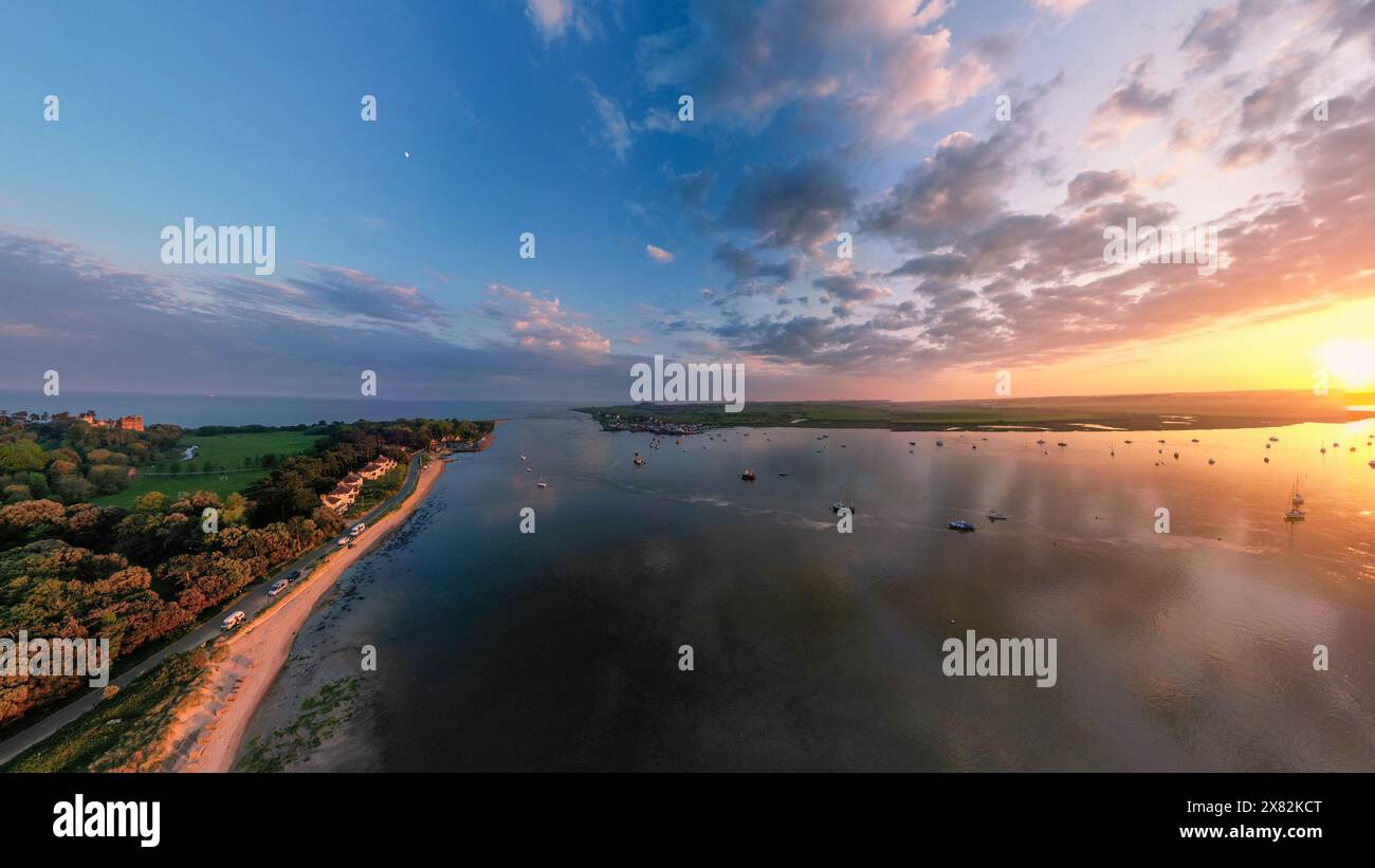An aerial view of a spectacular sunset over the River Deben at Bawdsey ...