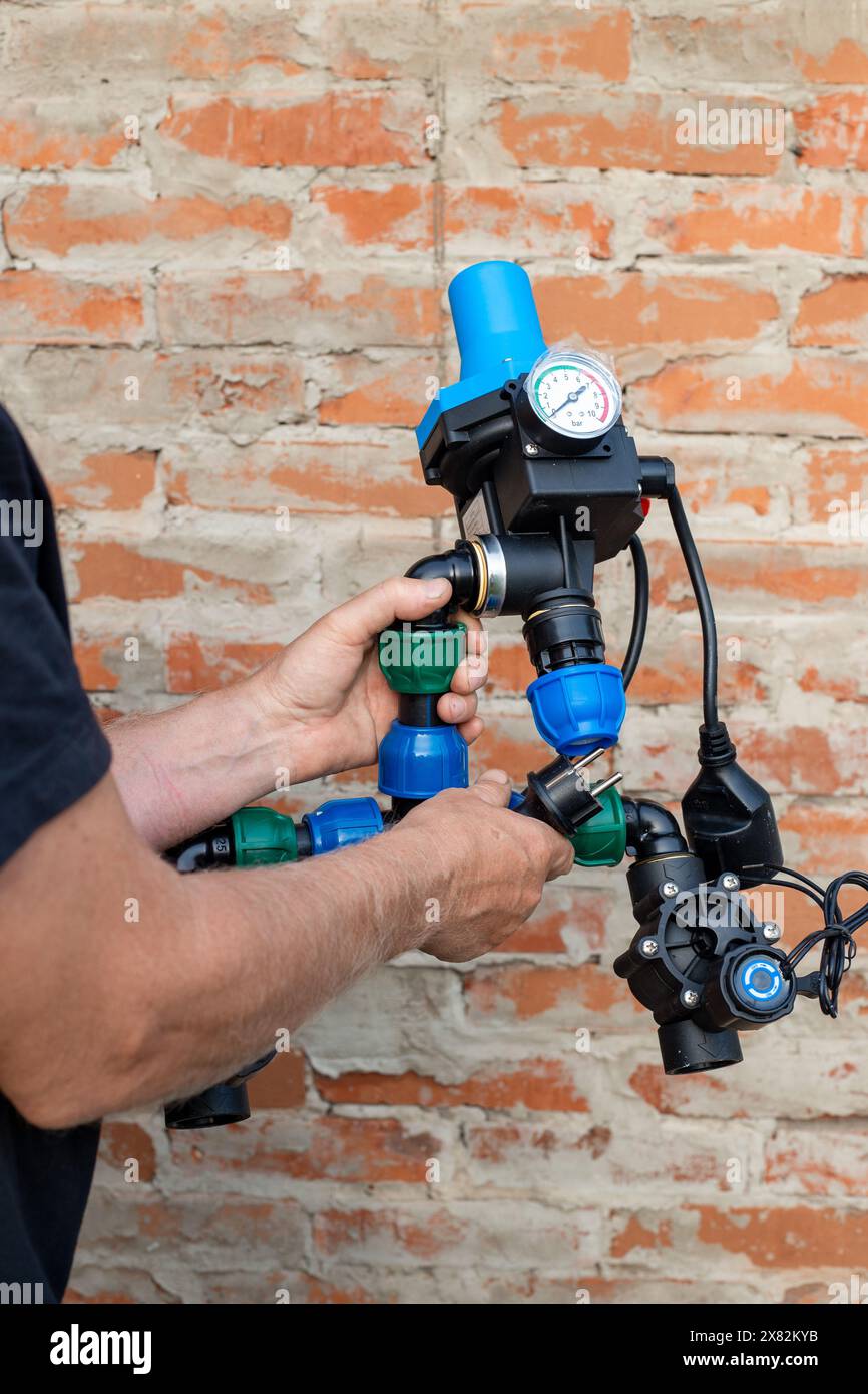 Assembling an automatic water supply system for drip irrigation ...