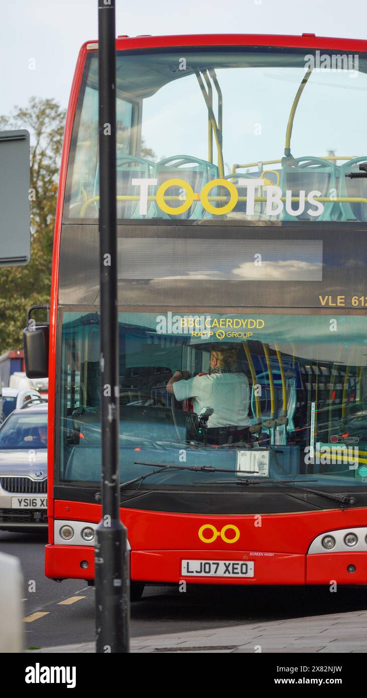 Cardiff, Wales, October 29 2023: Bright red, double decker Cardiff city ...