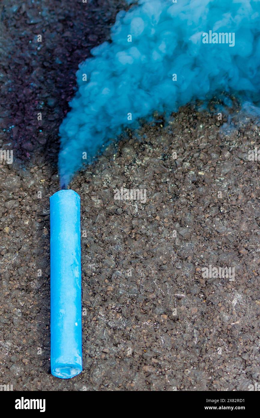 Fiery blue smoke intertwines with dangerous outdoor fireworks and hints ...