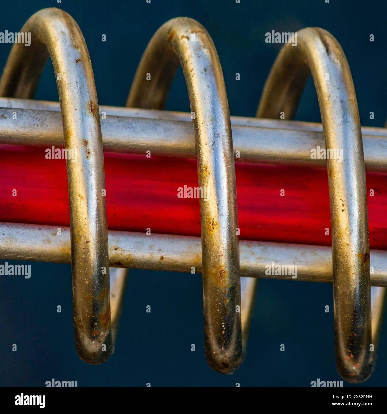 close up of a metal spring with a plain background Stock Photo - Alamy