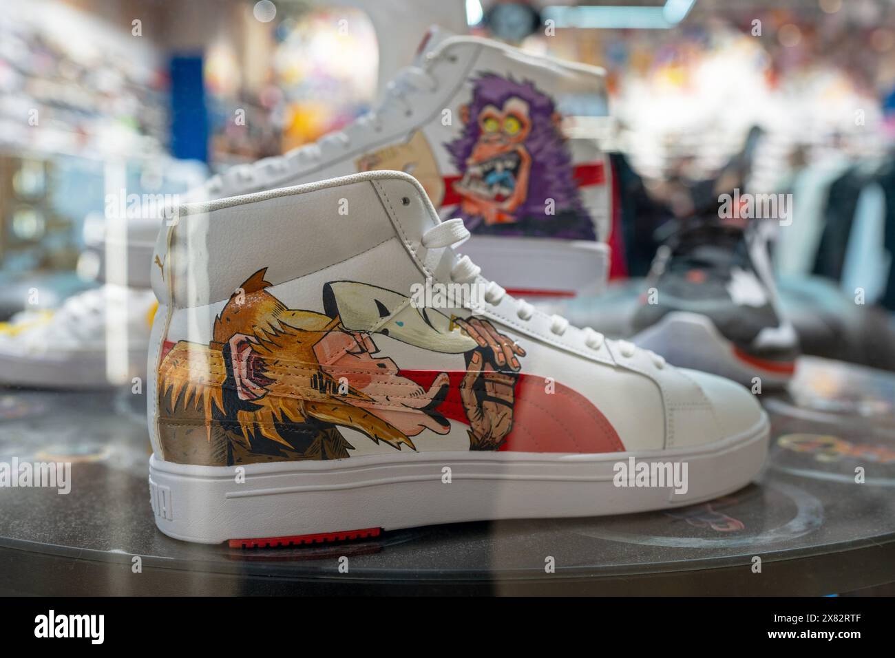 The art of painting shoes. A colorful Puma sneakers painted freshly ...