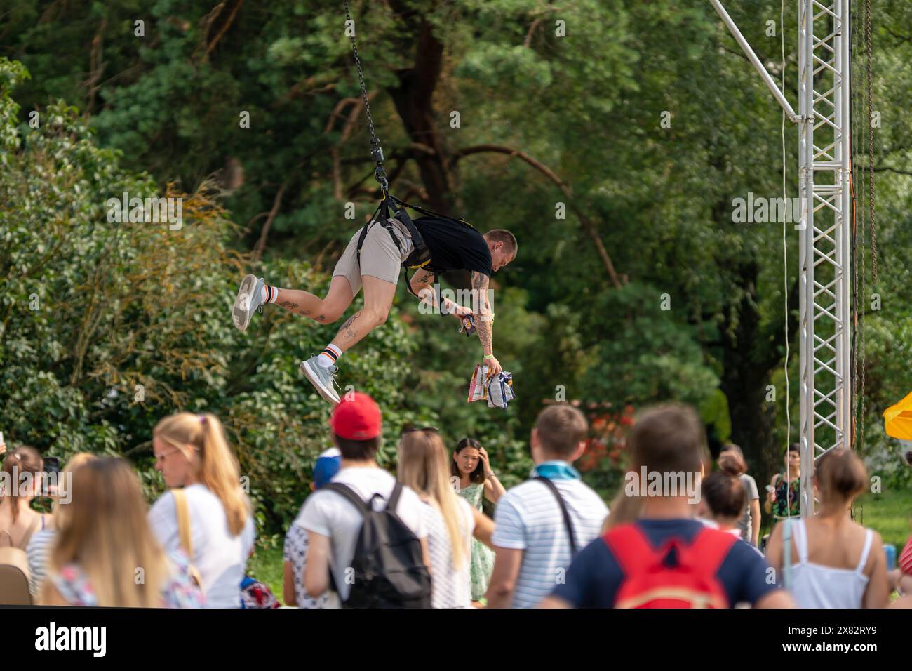 Large crane machine with human claws, with real people's claws. Arcade ...