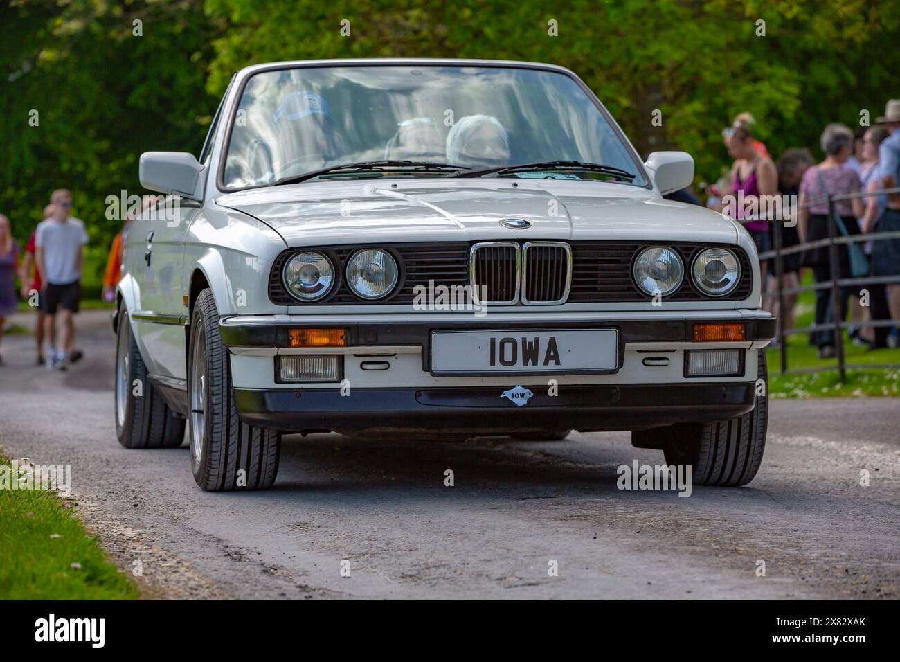 Head on shot of a BMW e30 convertible entering a car show Stock Photo ...