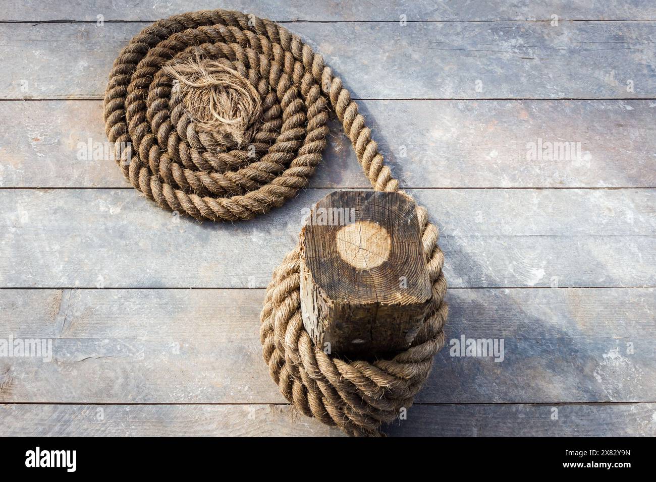 a brown round rope on the boat deck taken from the top view Stock Photo ...