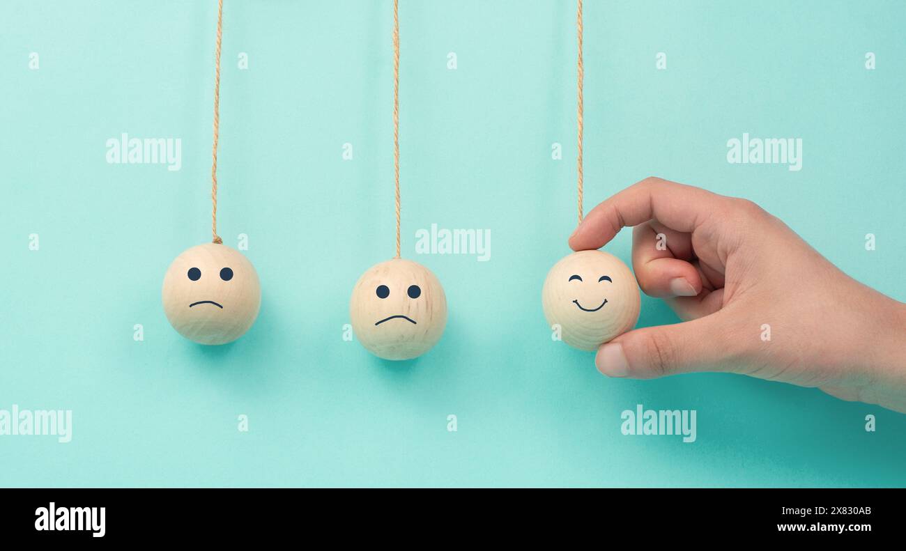 Happy smiling face spread happiness to sad faces, newton cradle concept ...