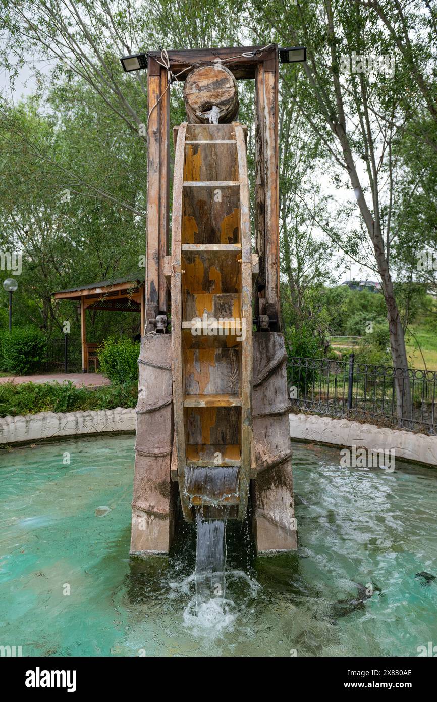 Water mill wheel and waterfall on the river. Sustainable energy and ...