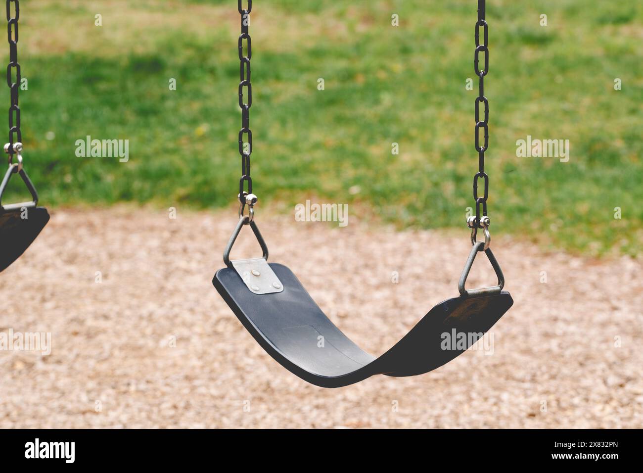 Detail shot of an empty playground swing Stock Photo - Alamy