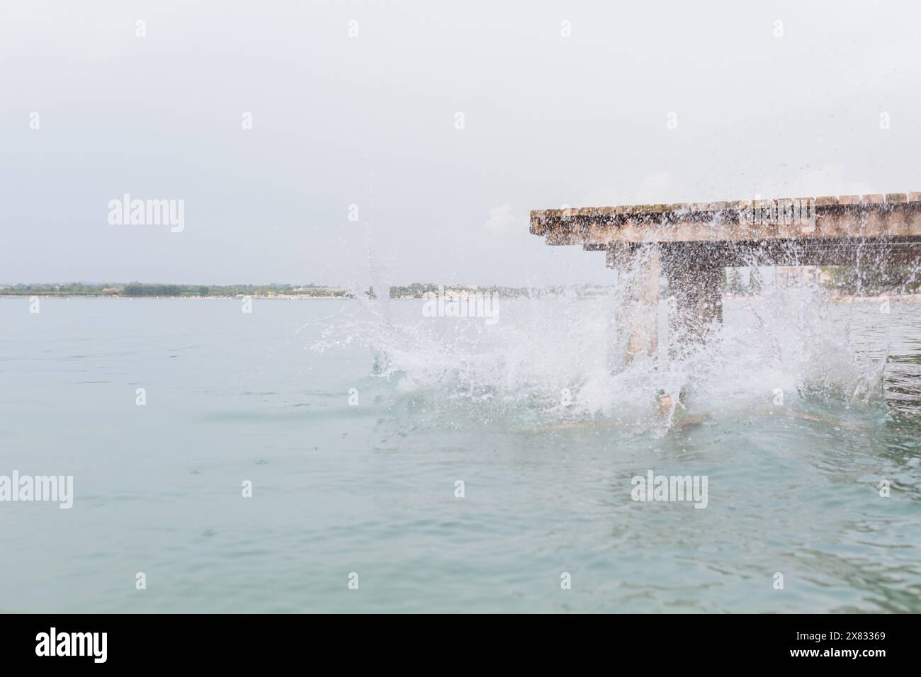 big splashes on the water after the double jump Stock Photo - Alamy