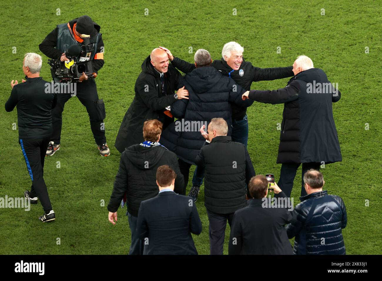 Atalanta manager Gian Piero Gasperini (second right) celebrates with ...