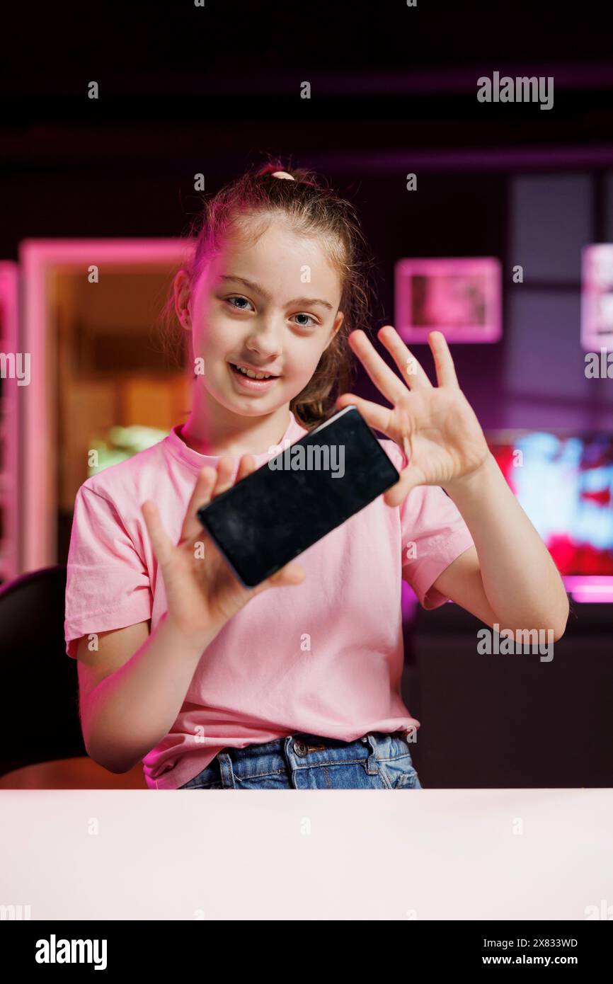 Portrait of content creator kid excited to review newly launched ...