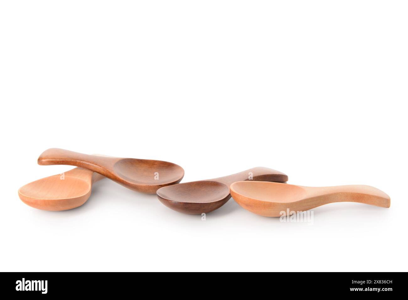 Empty wooden spoons on white background Stock Photo - Alamy