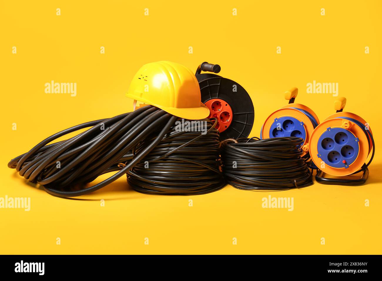 Rolled flexible conduit tube, cables, hardhat and extension cable reels ...