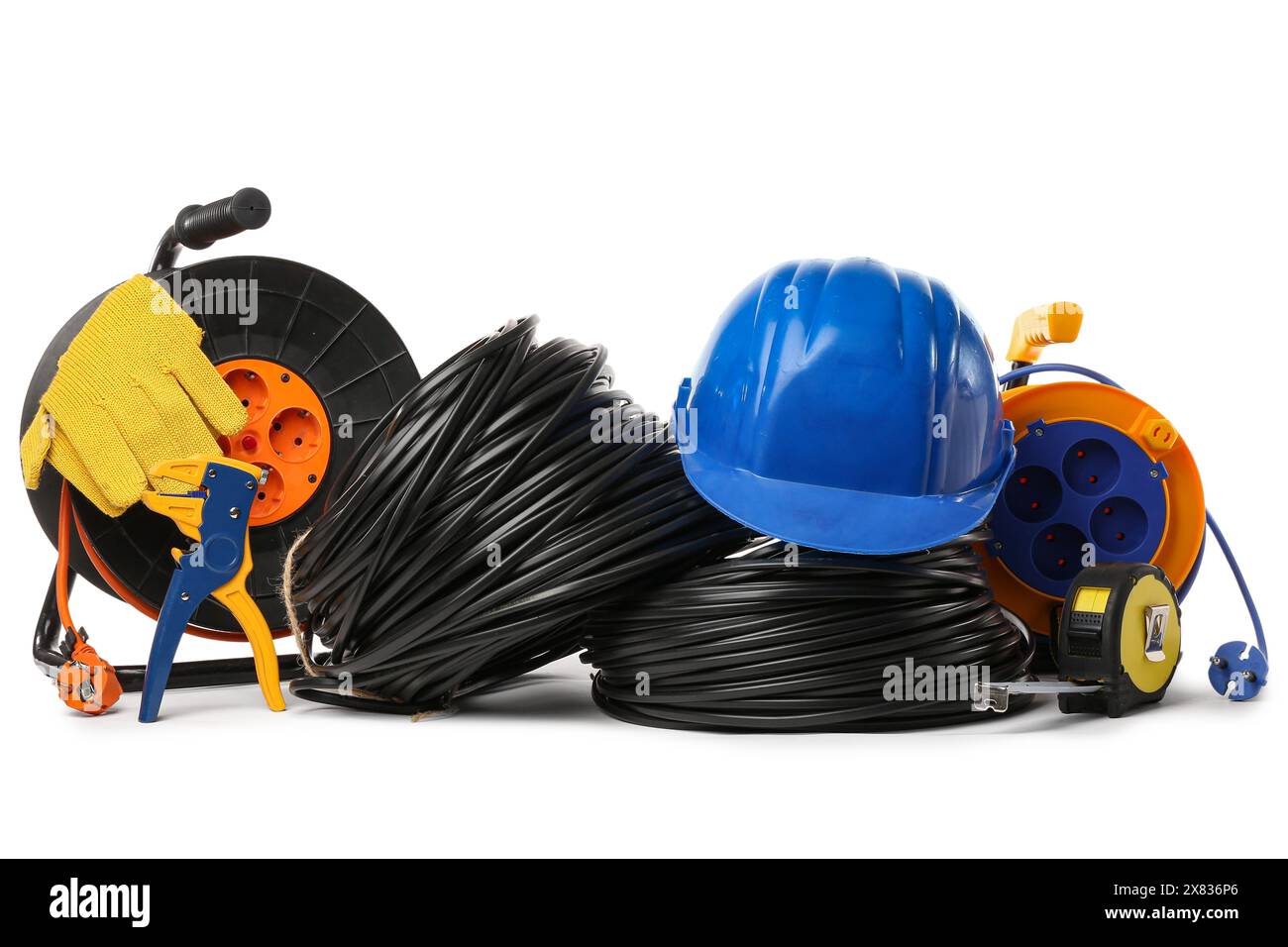 Rolled cables, hardhat, wire stripper and extension cable reels on ...