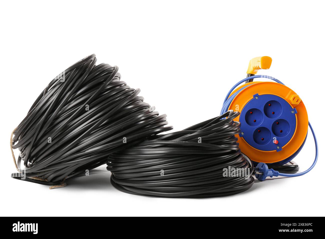 Rolled cables and extension cable reel on white background Stock Photo ...